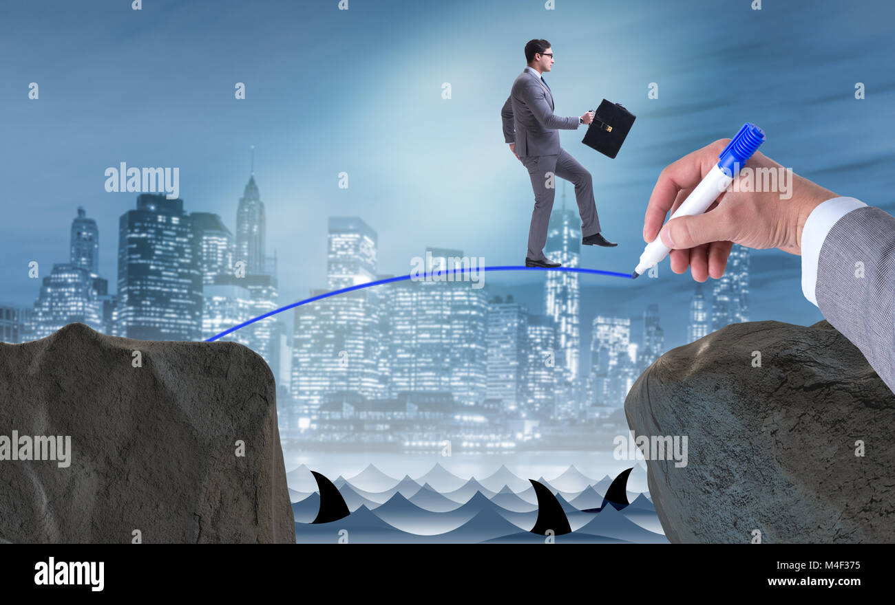 Hand drawing bridge under businessman Stock Photo - Alamy