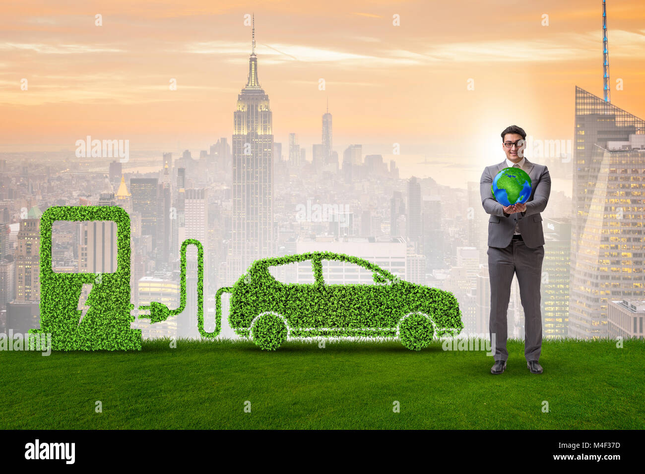 Electric car concept in green environment concept Stock Photo - Alamy