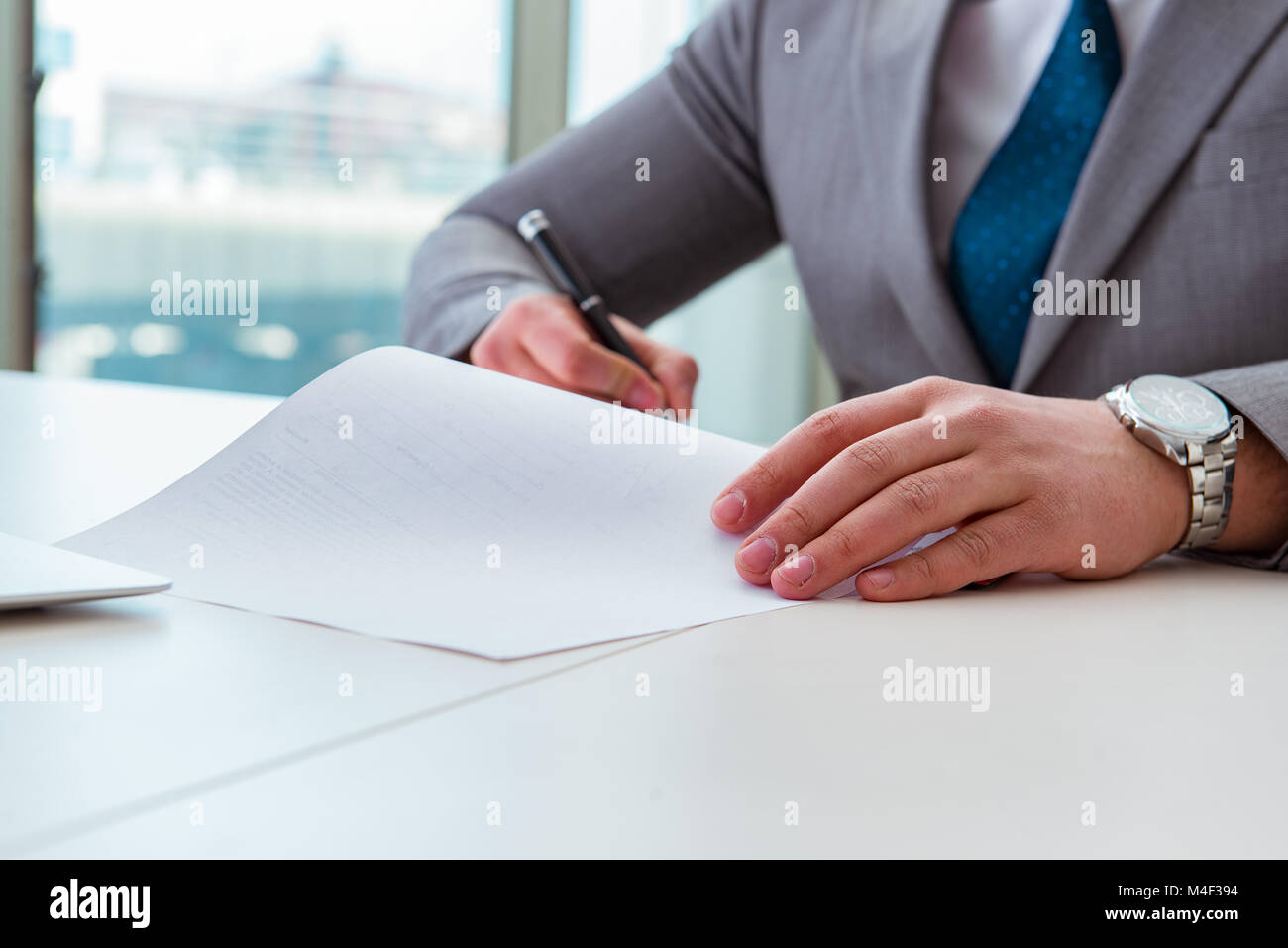 Businessman taking notes at the meeting Stock Photo - Alamy