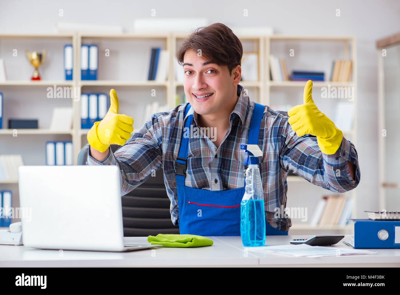Male cleaner working in the office Stock Photo - Alamy