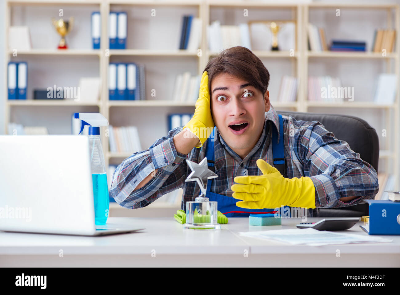 Male cleaner working in the office Stock Photo - Alamy