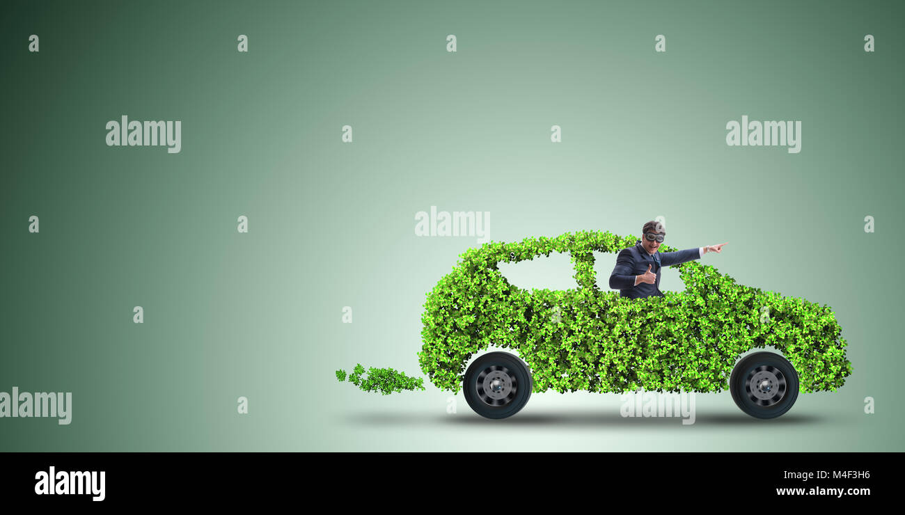 Electric car concept in green environment concept Stock Photo - Alamy