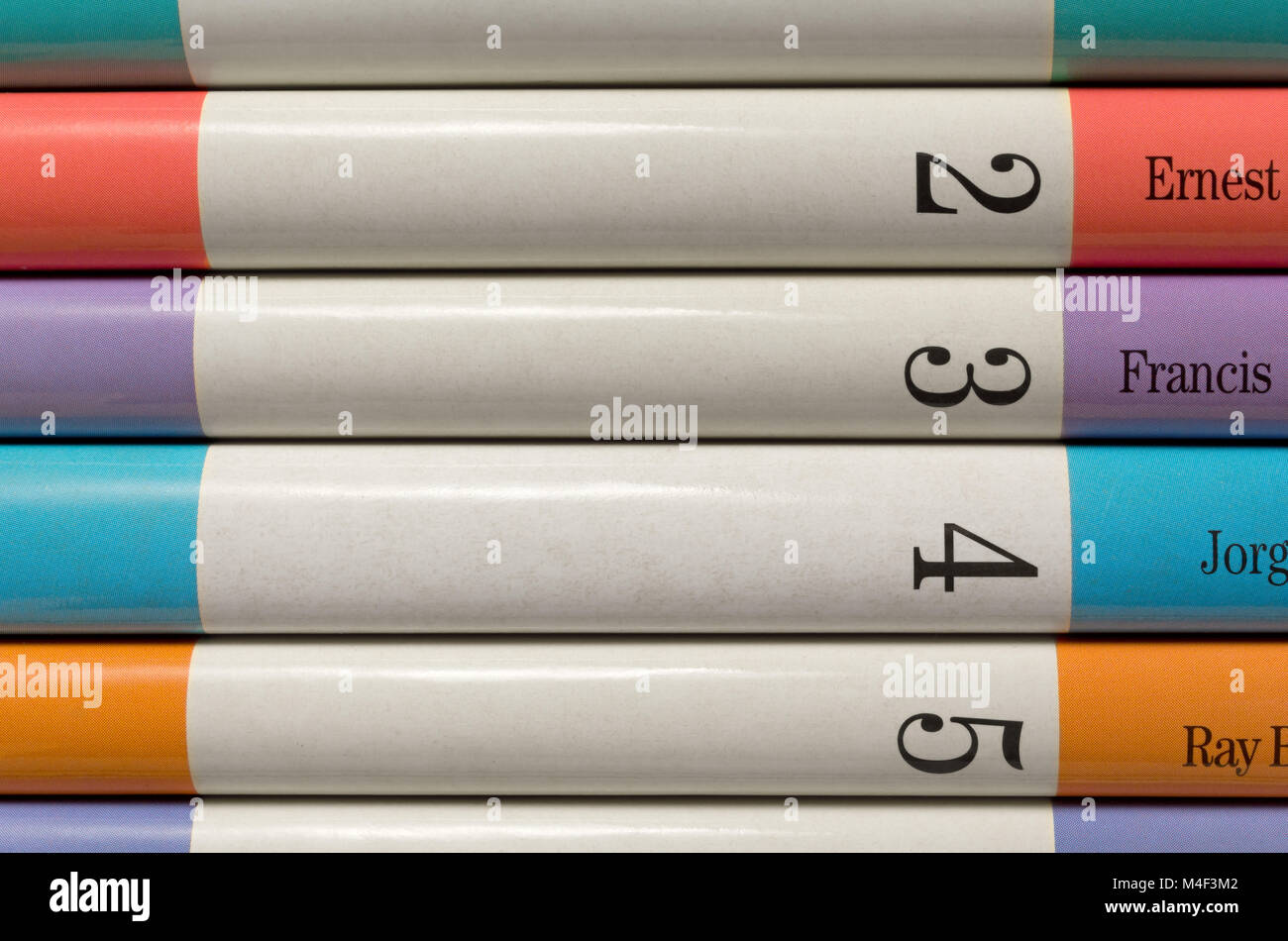 Stacked colored numbered books Stock Photo - Alamy