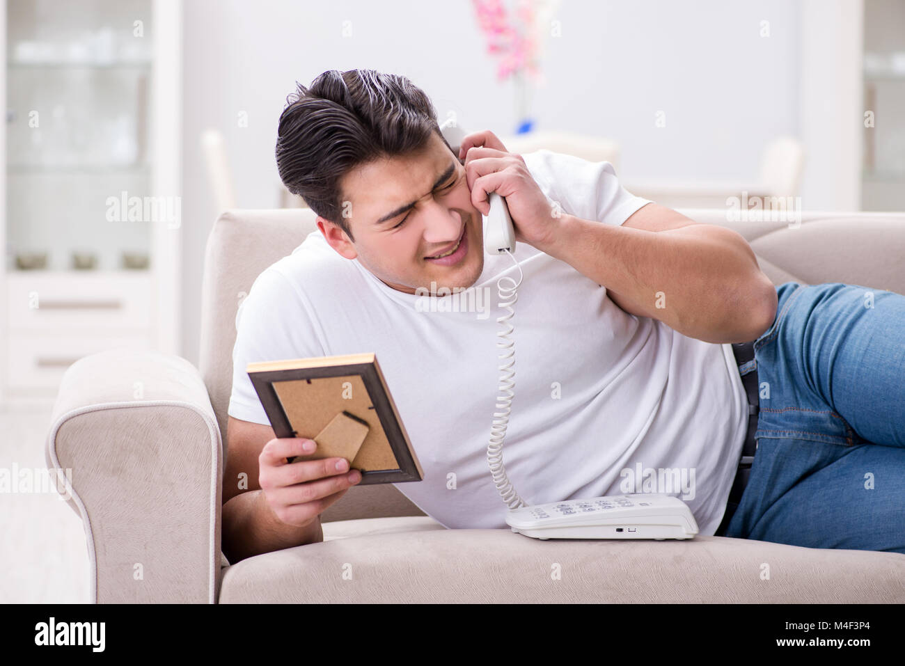 Young man in sad saint valentine concept Stock Photo - Alamy