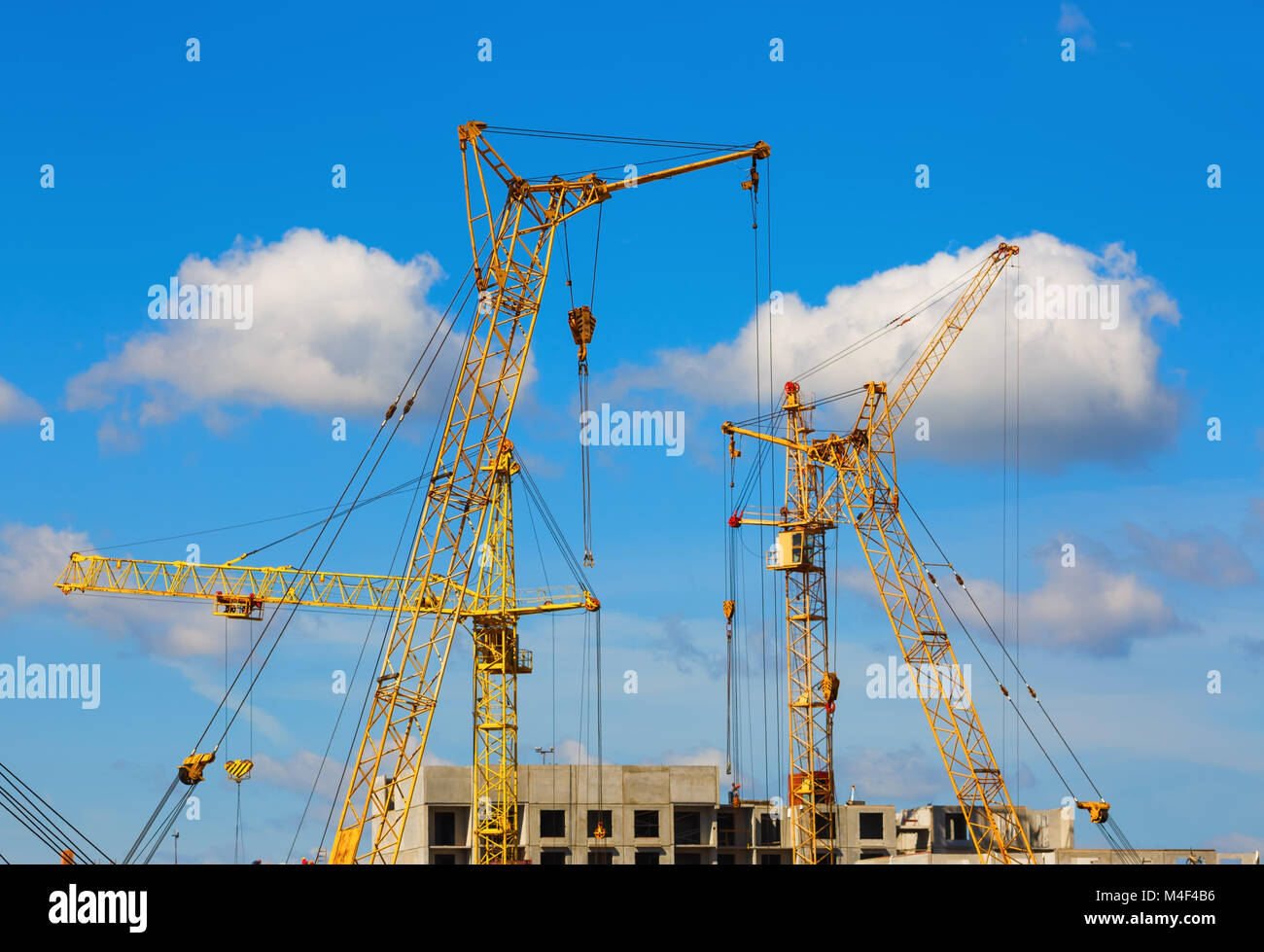 Yellow construction cranes Stock Photo - Alamy