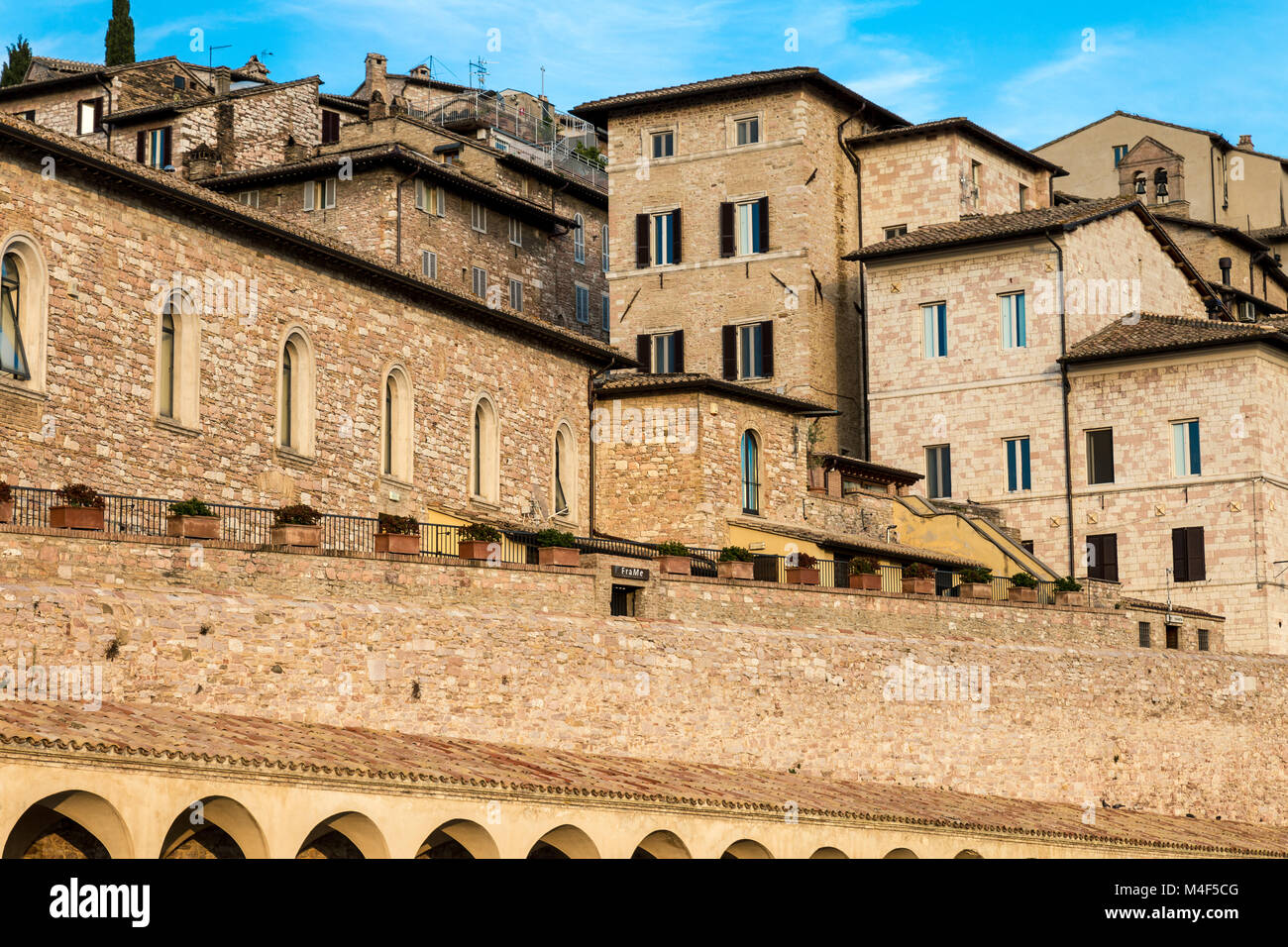 A cityscape of medieval houses of Assisi Italy Stock Photo - Alamy