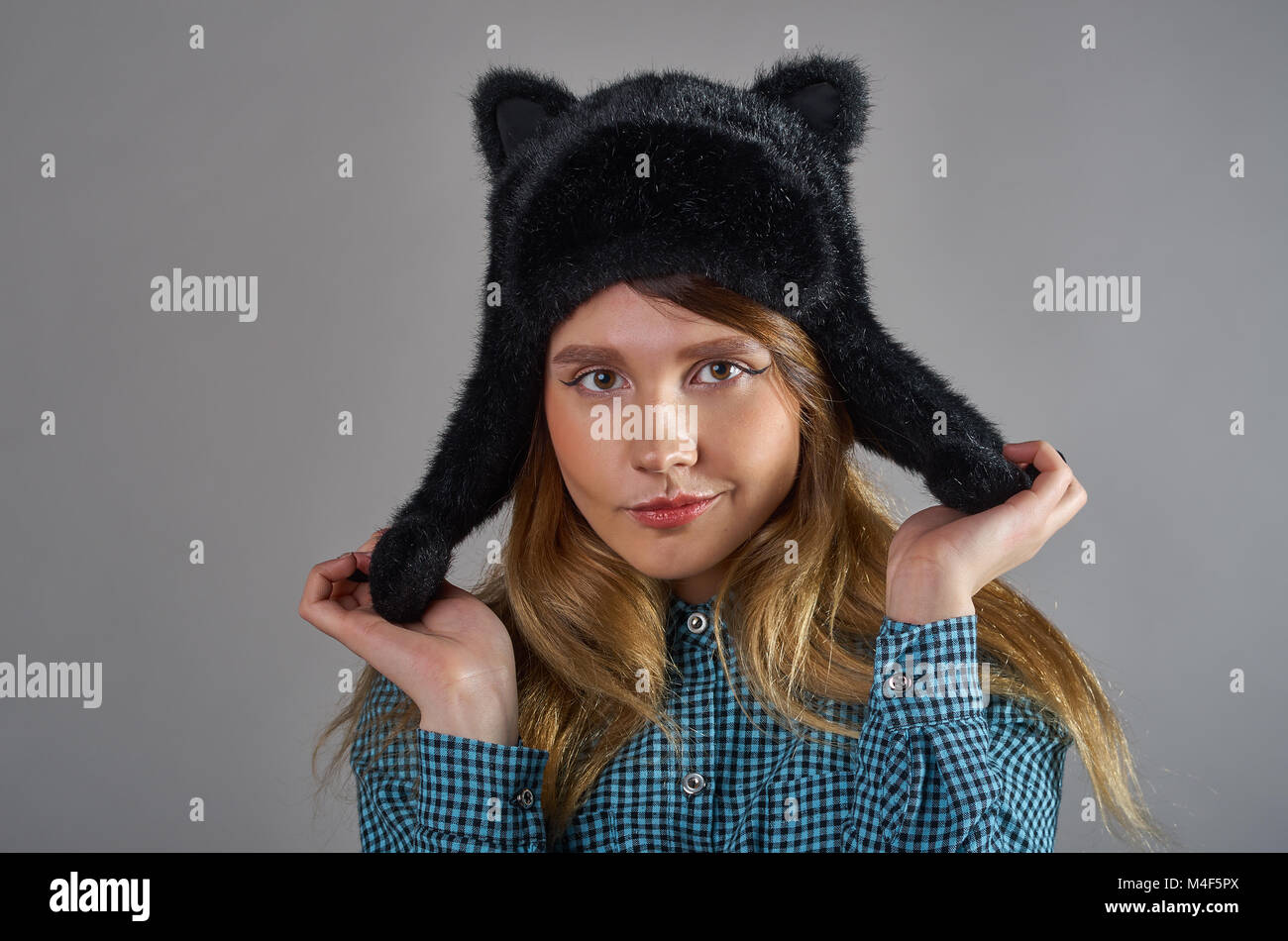 young pretty fair-haired teenage hipster girl emotional posing ...