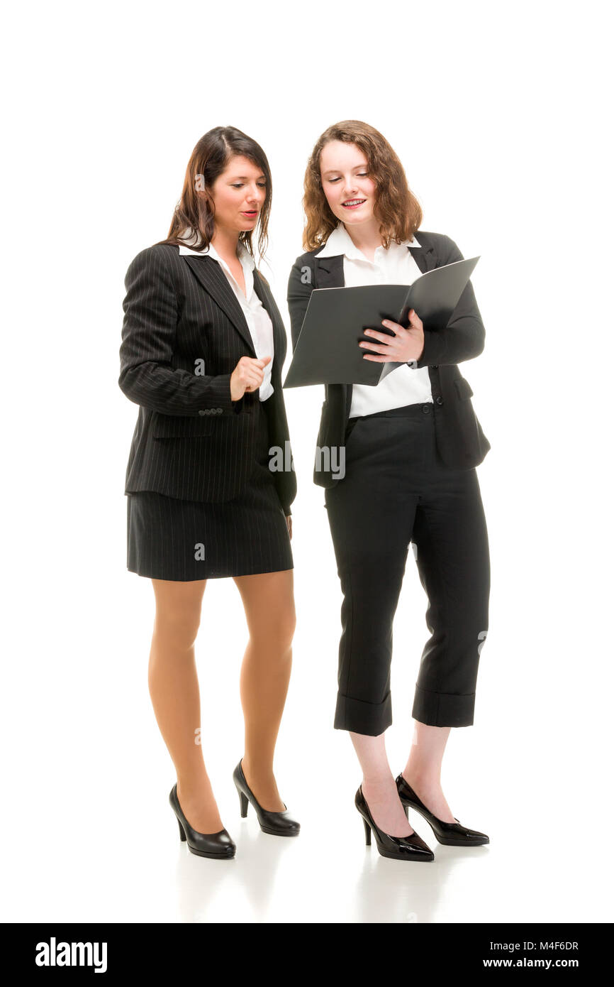 Two young business women in full li Stock Photo - Alamy