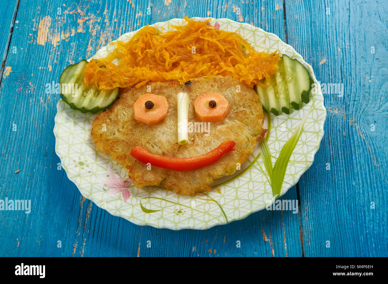 creative food concept - Funny potato fritters for kids Stock Photo - Alamy