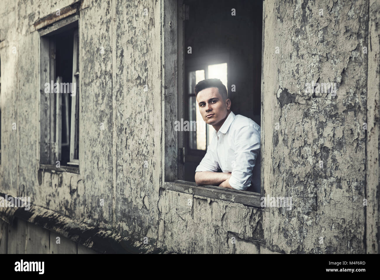 Man looks out window office hi-res stock photography and images - Alamy