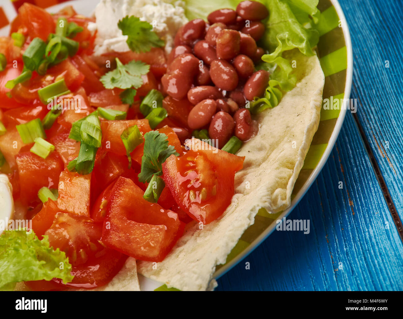 East African cuisine - Timatim Tomato Salad, Traditional assorted ...