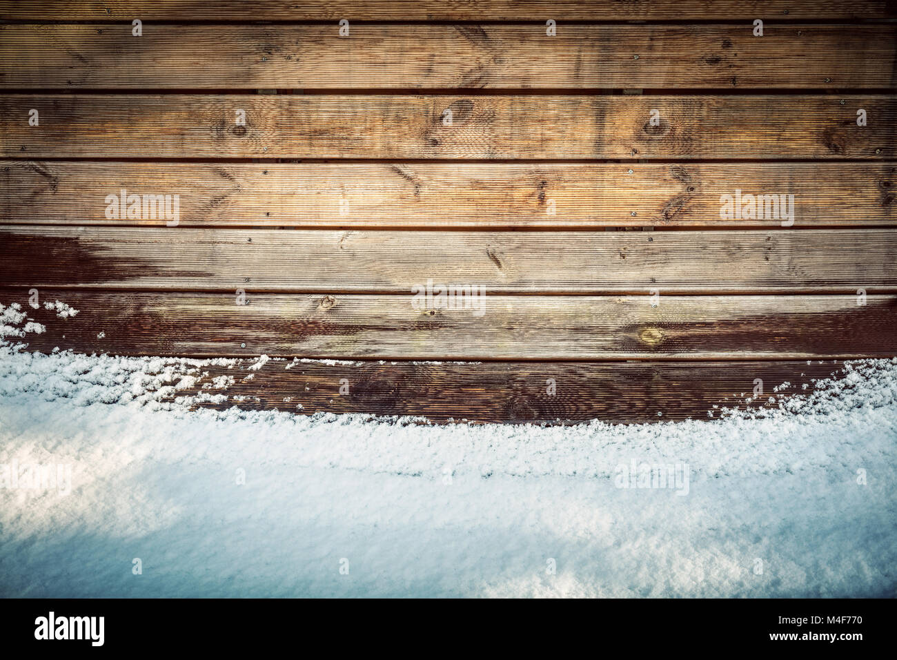 Grunge wooden board in snow. Winter background Stock Photo - Alamy