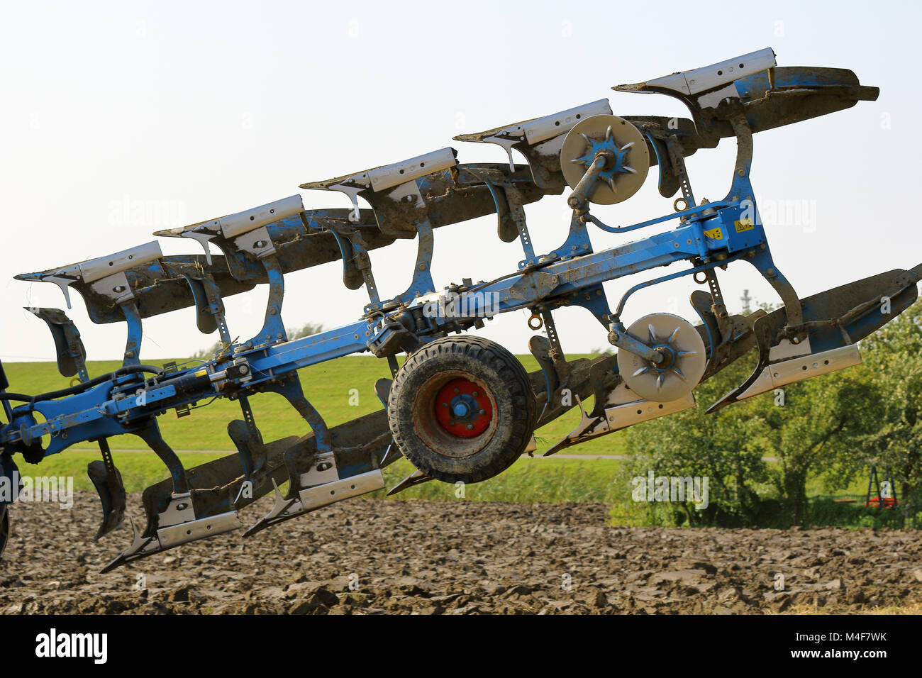 Plow in action Stock Photo - Alamy