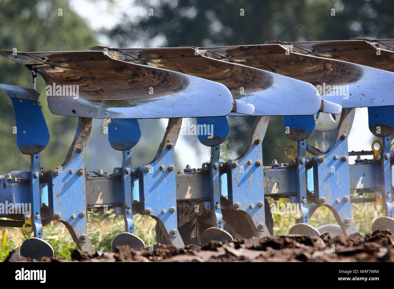Plow in action Stock Photo - Alamy