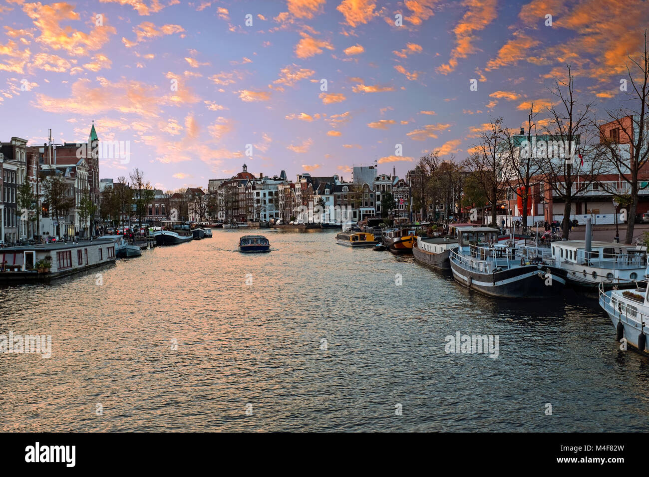 City scenic from Amsterdam in the Netherlands at the river Amstel Stock ...