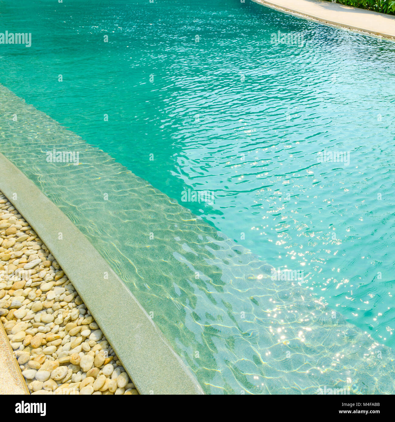 Beautiful luxury swimming pool in hotel resort. Decoration and design ...