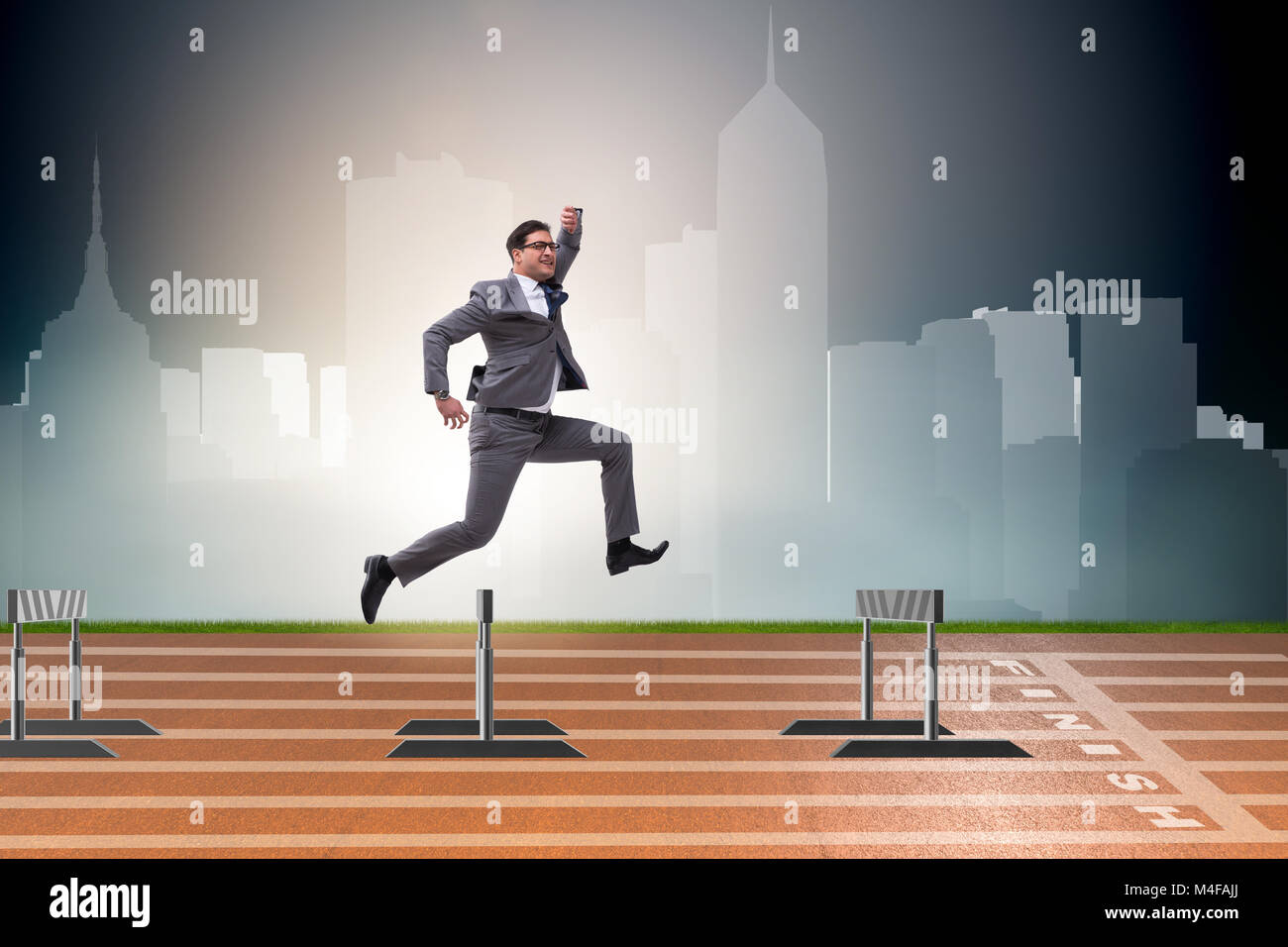 Businessman jumping over barriers in business concept Stock Photo - Alamy