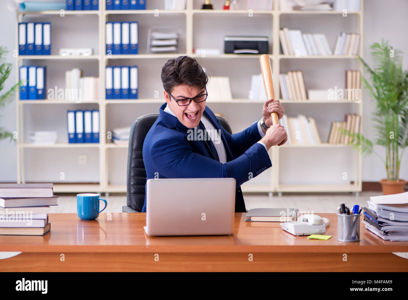 Angry aggressive businessman in the office Stock Photo - Alamy