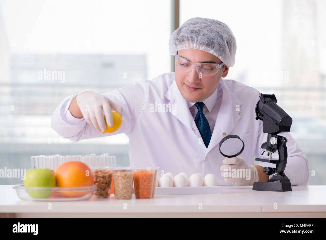 Nutrition expert testing food products in lab Stock Photo - Alamy
