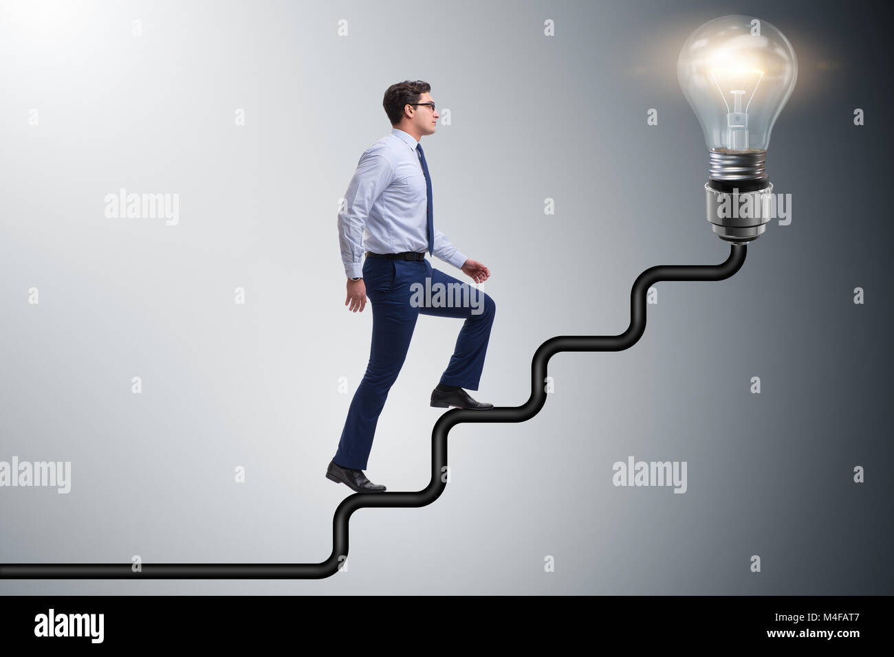 Man climbing career ladder towards bright light bulb Stock Photo - Alamy