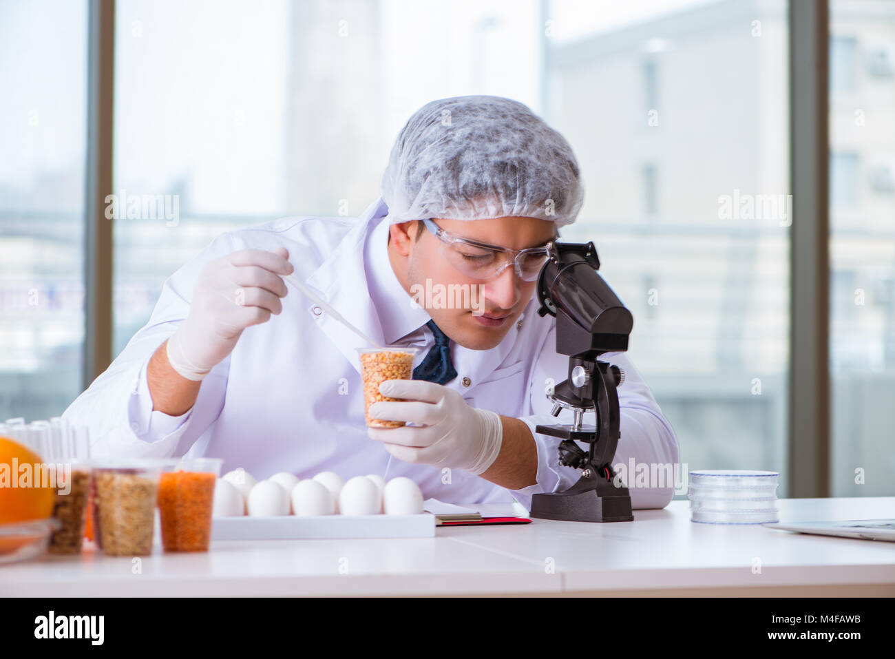 Nutrition expert testing food products in lab Stock Photo - Alamy
