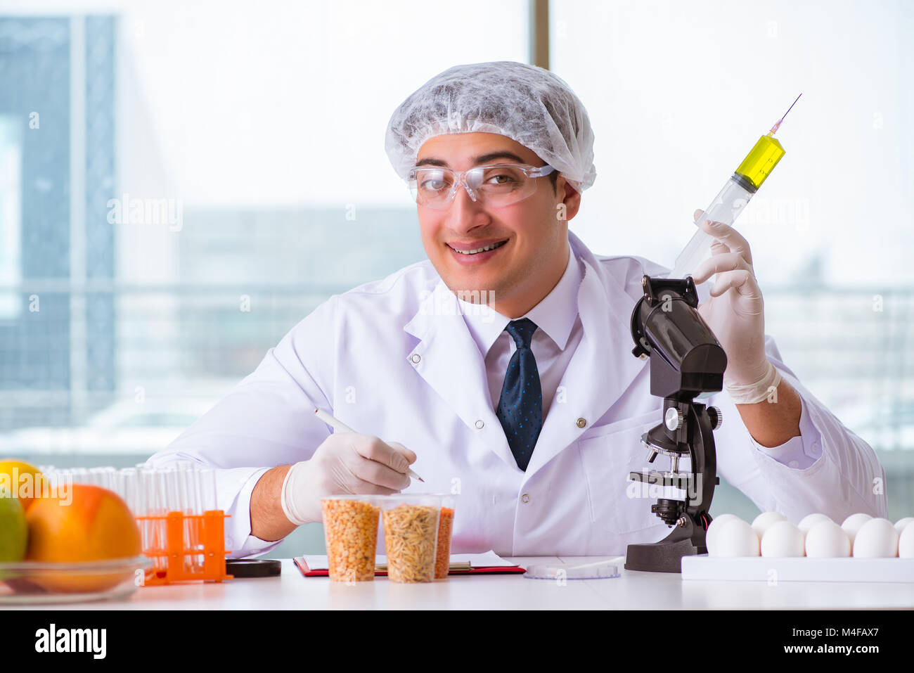 Nutrition expert testing food products in lab Stock Photo - Alamy