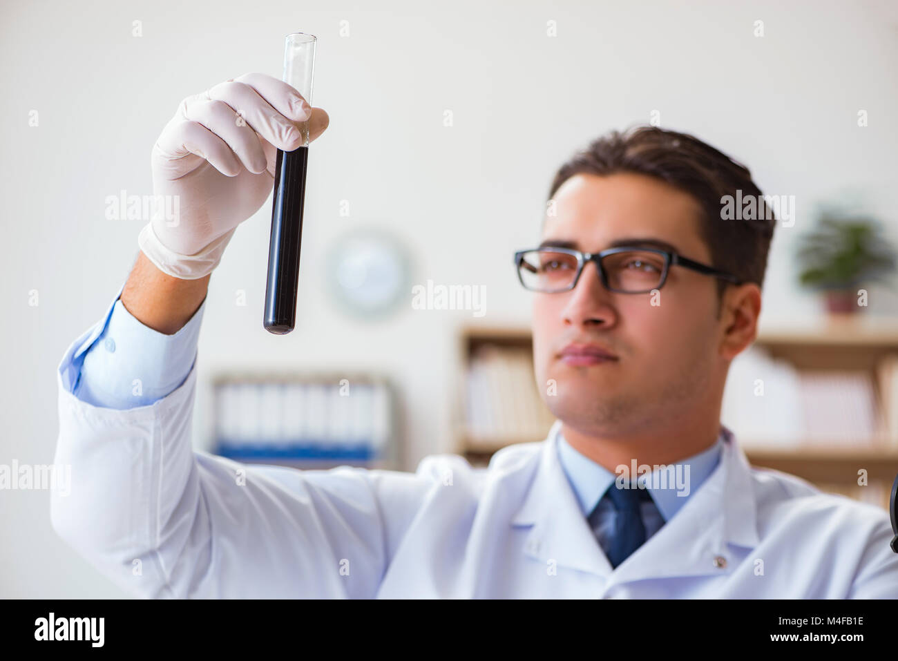 Chemical engineer working on oil samples in lab Stock Photo - Alamy