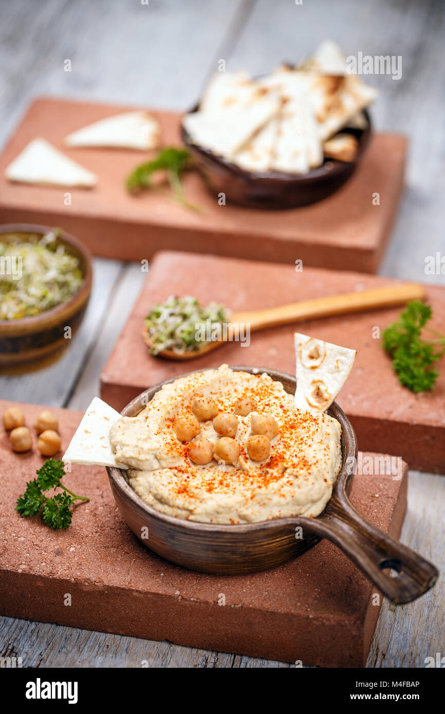 Healthy homemade creamy hummus with pita chips Stock Photo - Alamy
