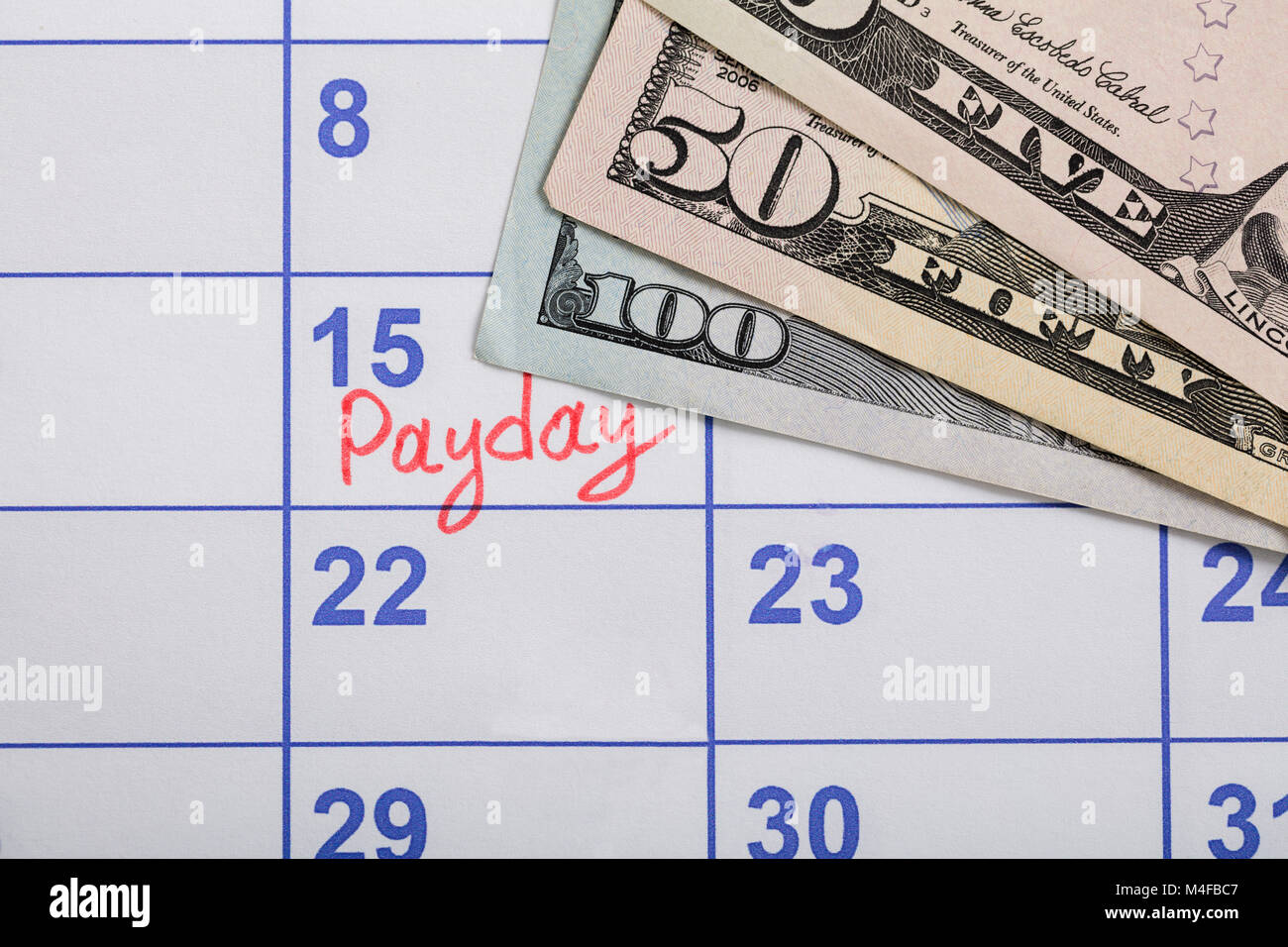 Close-up Of Pay Day Reminder On Calendar With Banknotes Stock Photo - Alamy