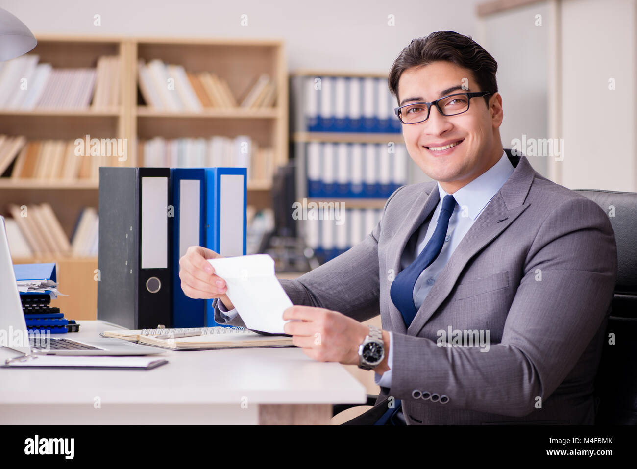 Businessman receiving letter in the office Stock Photo - Alamy