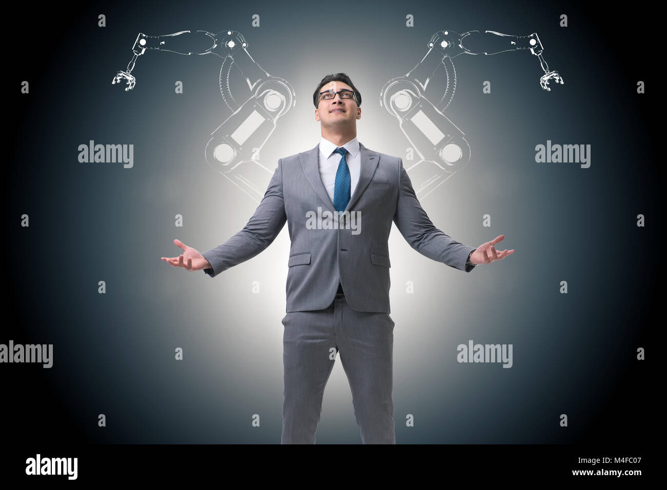 Businessman man with robotic arms Stock Photo - Alamy