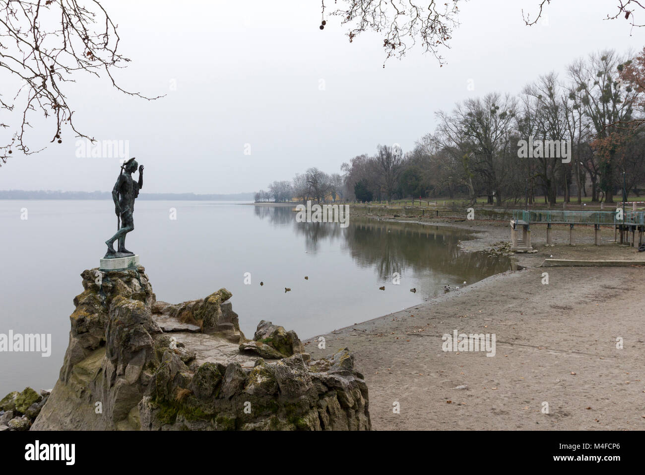 The so called "Old lake" in Tata, Hungary with the statue of Saint John ...