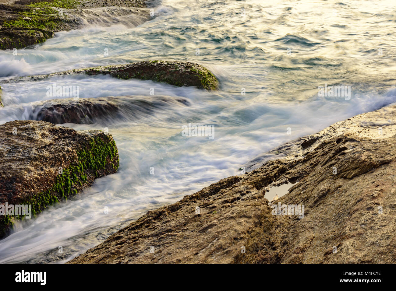 Water between the rocks Stock Photo - Alamy