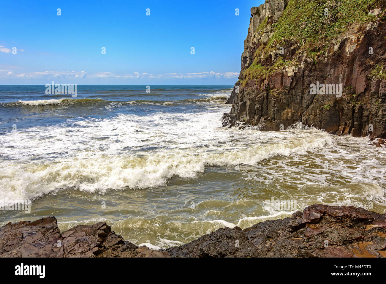 Waves between the rocks Stock Photo - Alamy