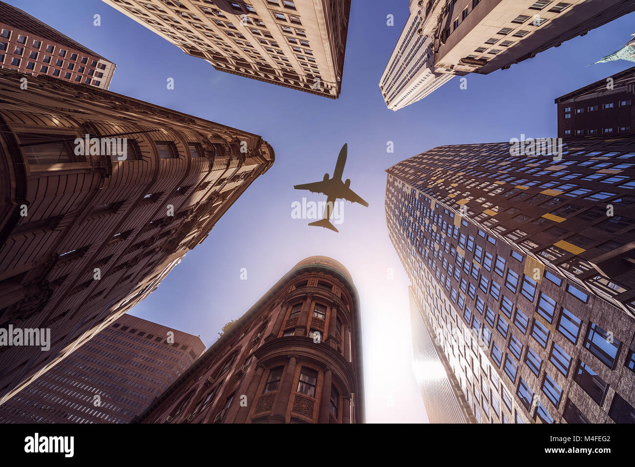 plane over highrise buildings Stock Photo - Alamy