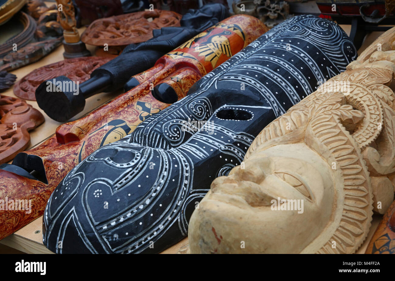 Close up Indian and African handmade ethnic wooden carved masks on ...