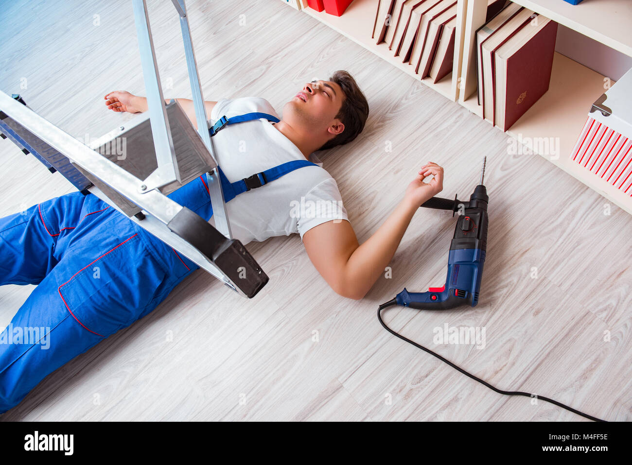 Unsafe behavior concept with falling worker Stock Photo - Alamy