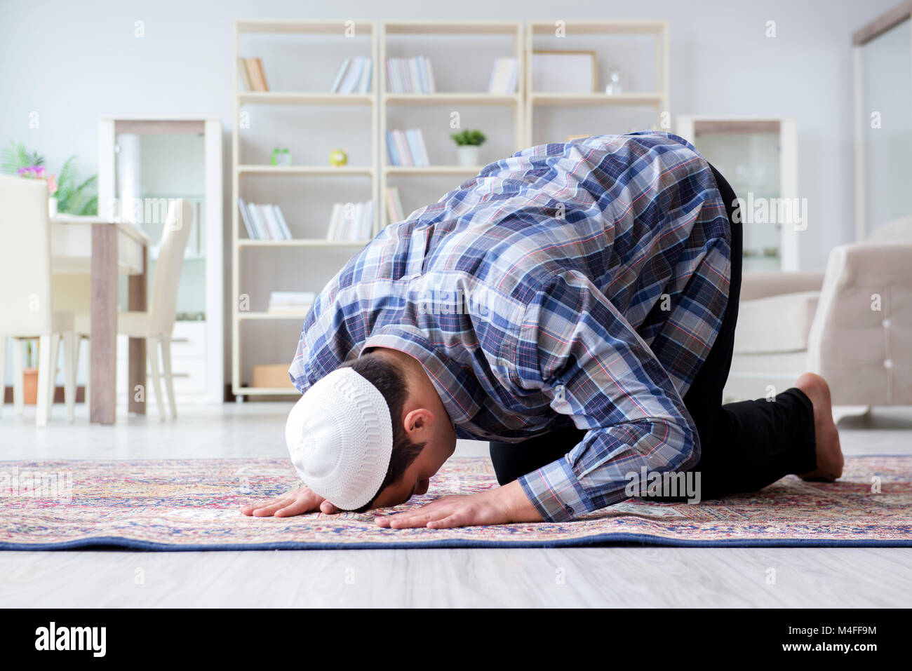 Muslim man praying at home Stock Photo - Alamy
