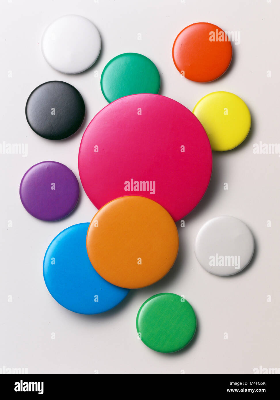 a collection of round badges of different colours plain and clean Stock ...