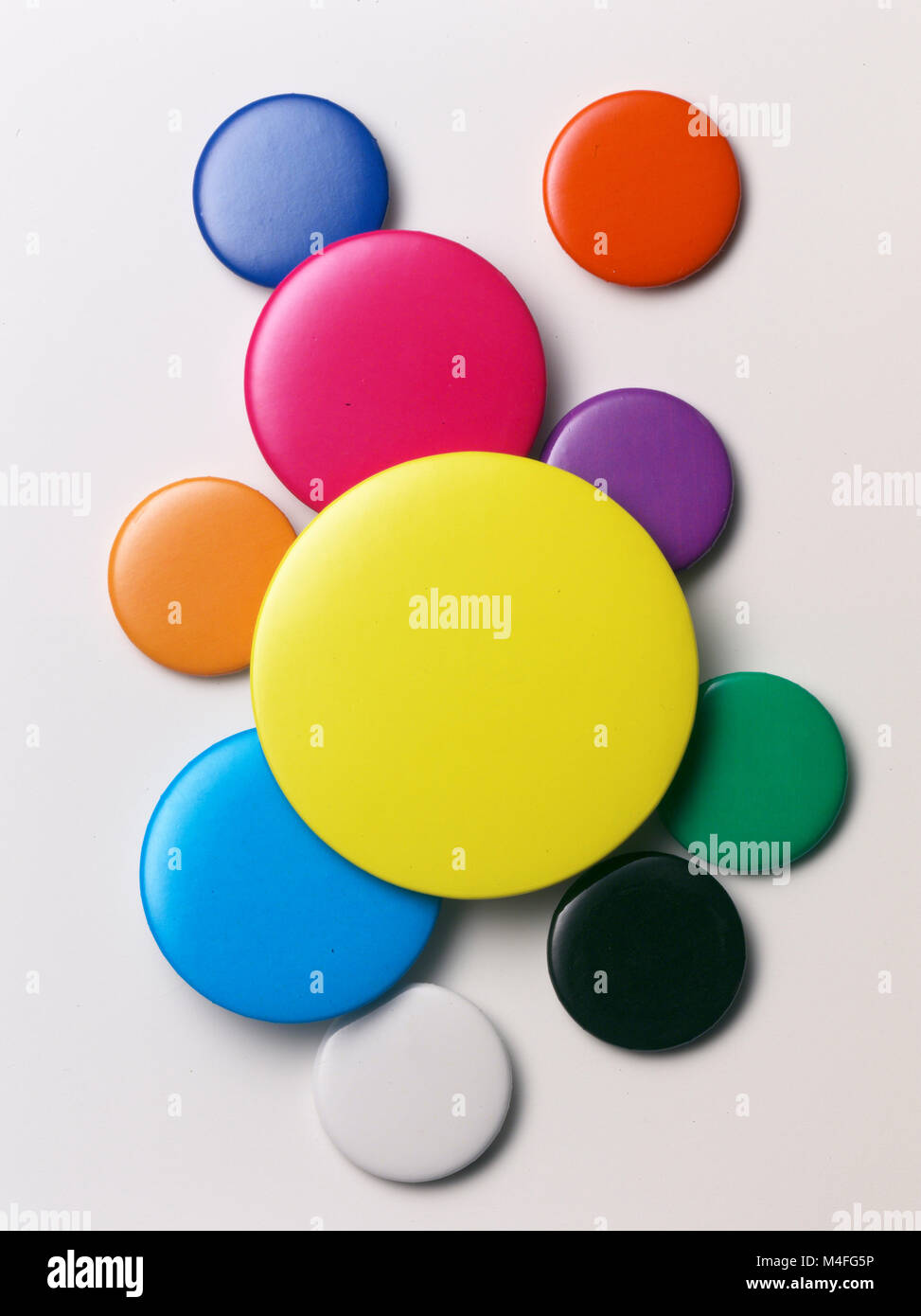 a collection of round badges of different colours plain and clean Stock ...