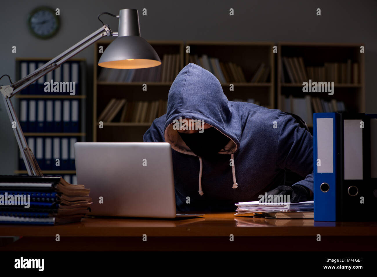 Hacker stealing personal data from home computer Stock Photo - Alamy