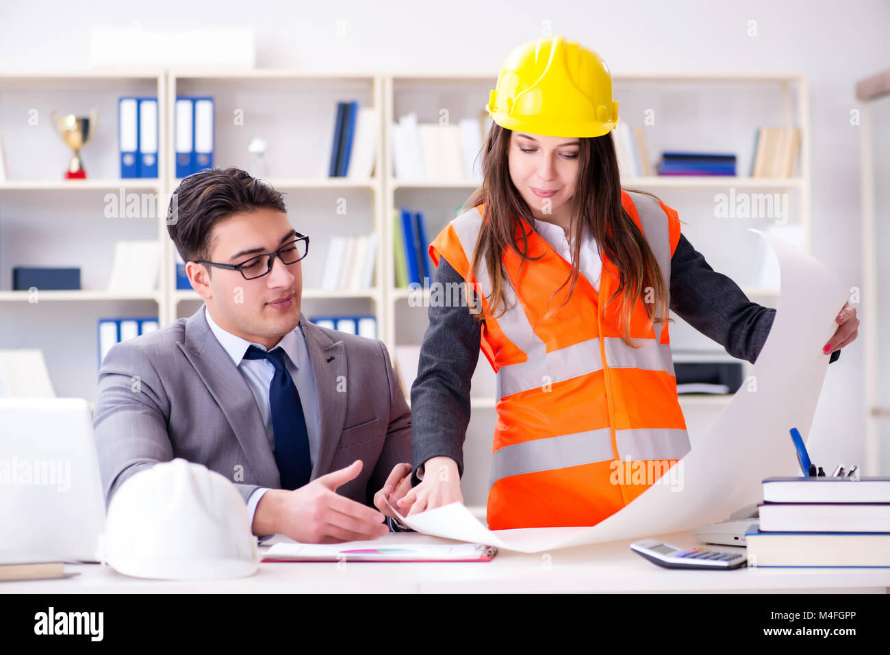 Reviewing architectural drawings hi-res stock photography and images ...