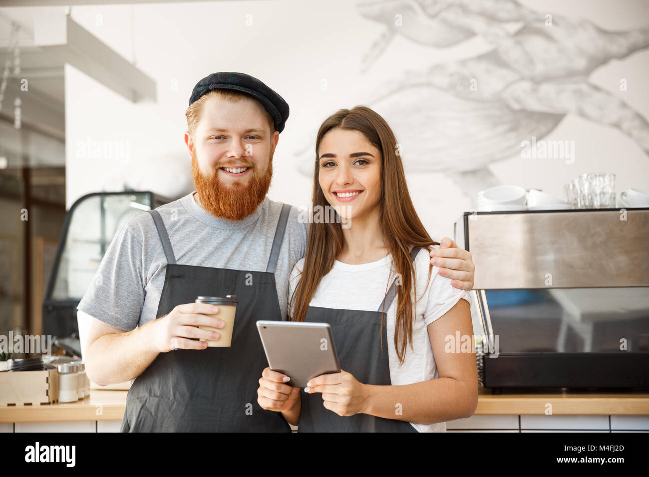 Business partners at counter of coffee shop hi-res stock photography ...