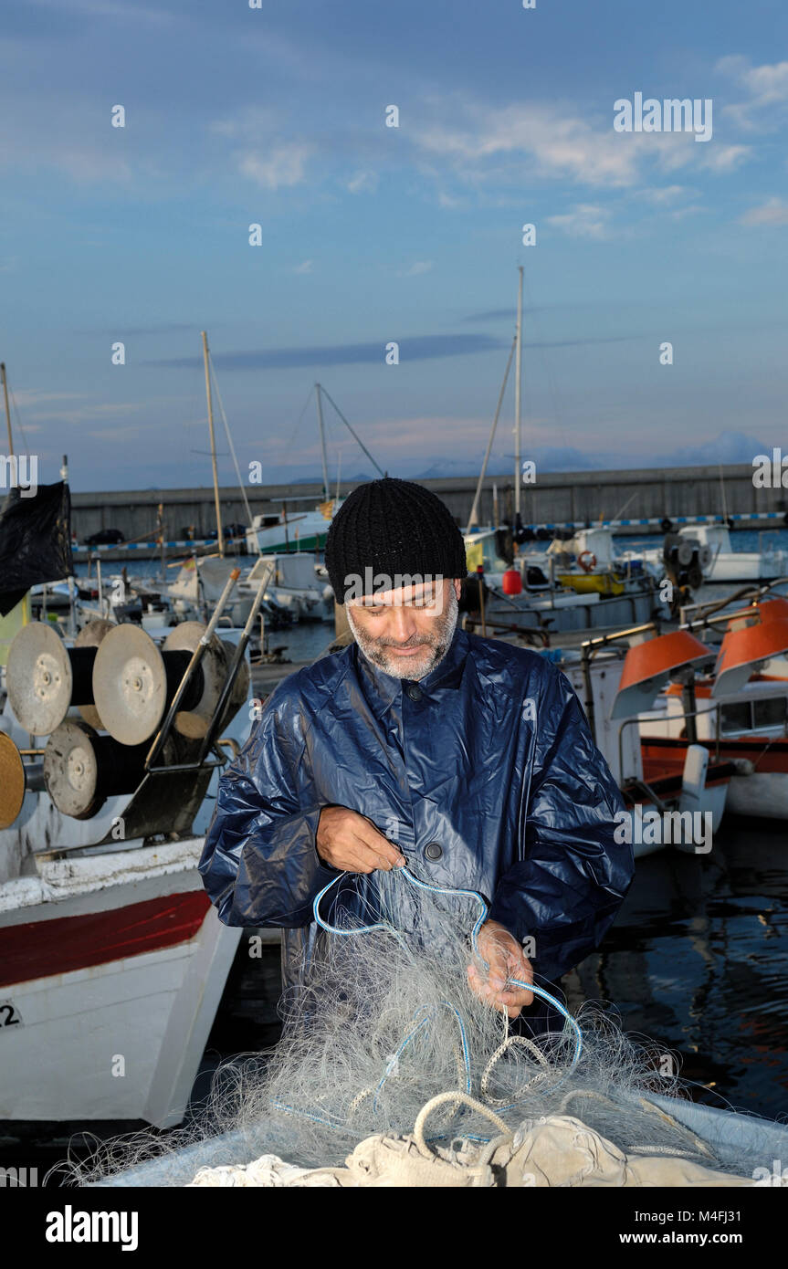 fisherman working in the fishing port Stock Photo - Alamy