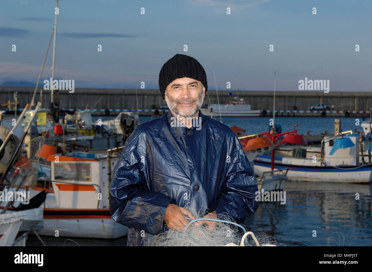 fisherman working in the fishing port Stock Photo - Alamy