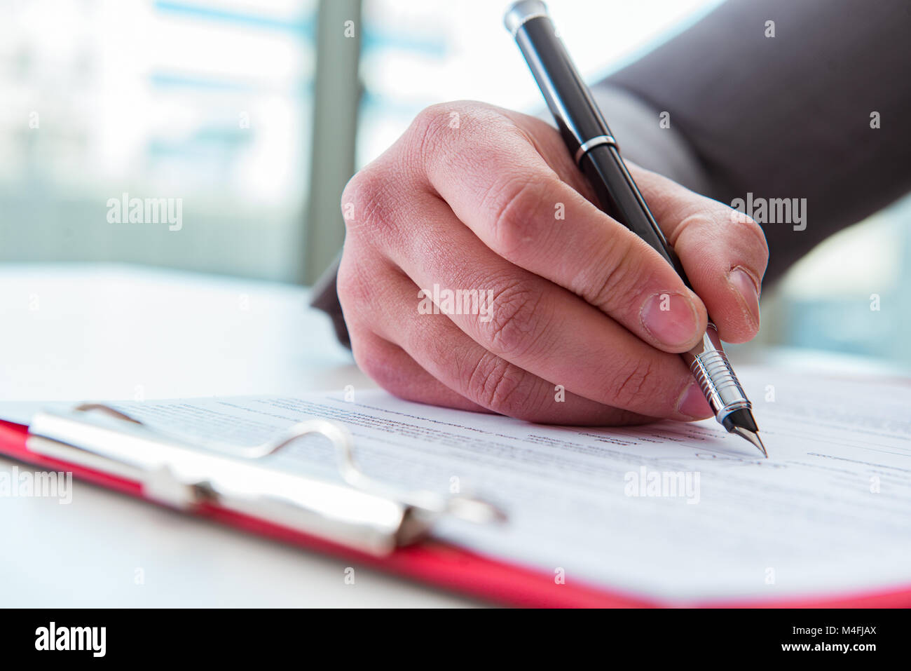 Businessman taking notes at the meeting Stock Photo - Alamy