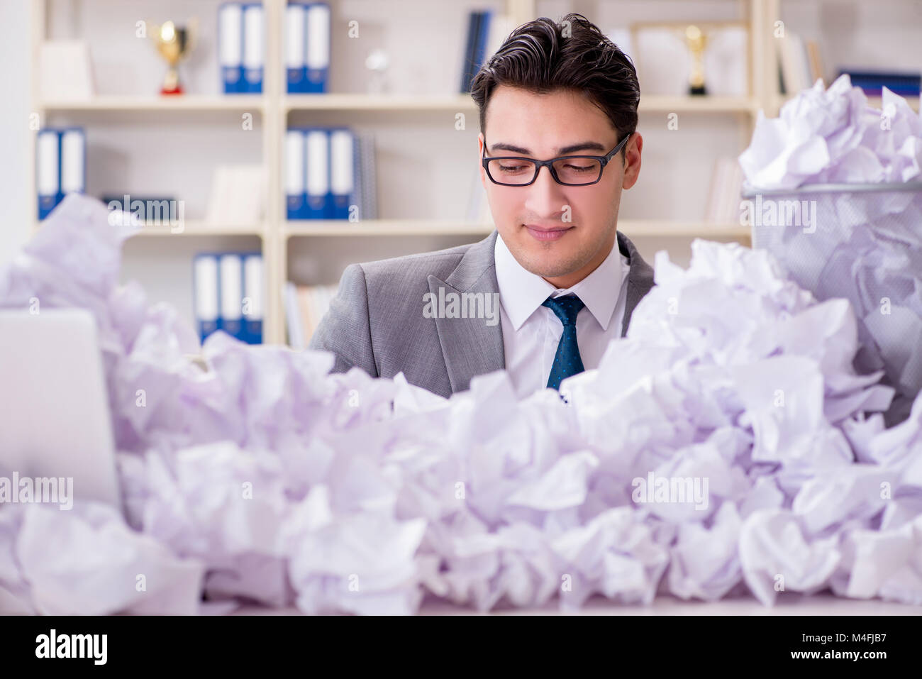 Businessman in paper recycling concept in office Stock Photo - Alamy