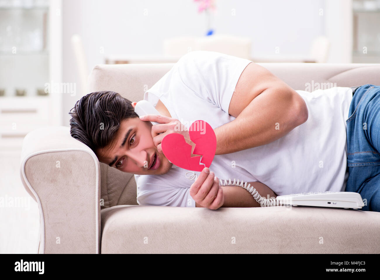 Young man in sad saint valentine concept Stock Photo - Alamy