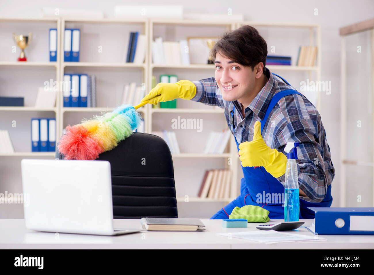 Male cleaner working in the office Stock Photo - Alamy