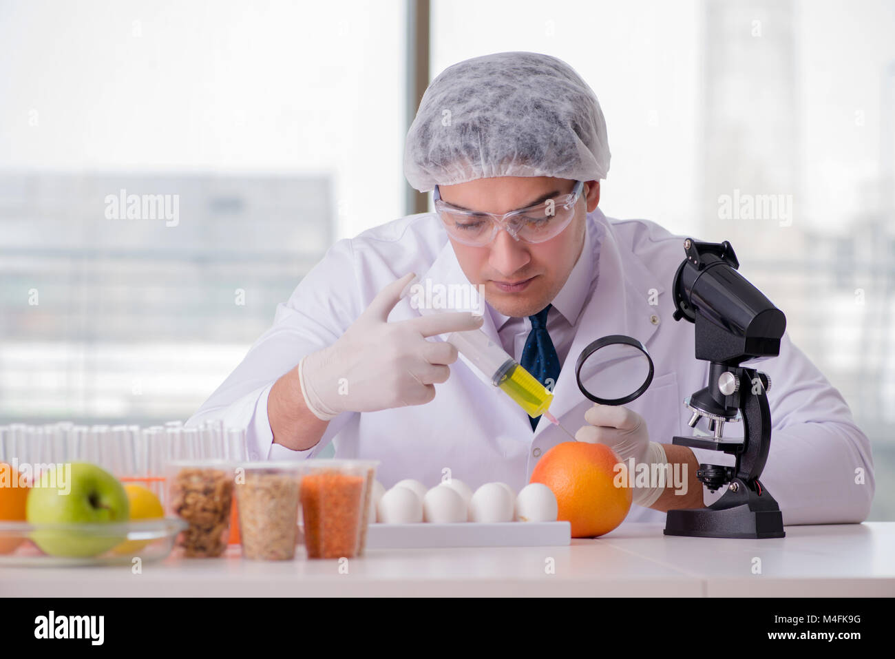Nutrition expert testing food products in lab Stock Photo - Alamy
